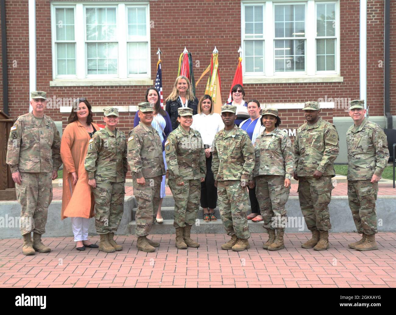 Soldiers and civilians of the 1st Theater Sustainment Command stand ...