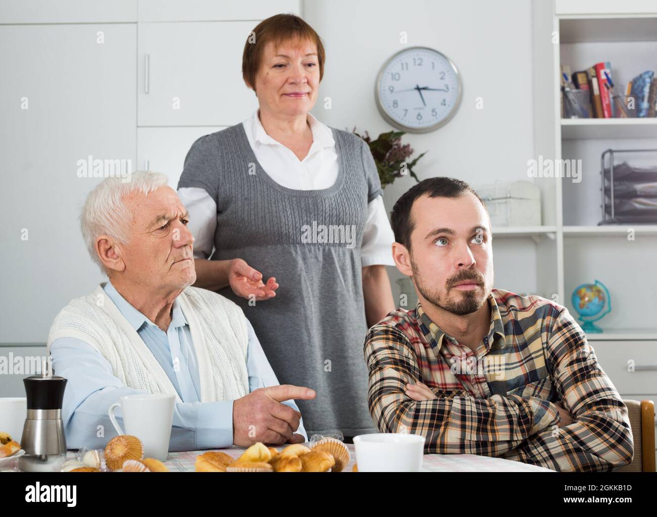 Parents arguing with son Stock Photo - Alamy