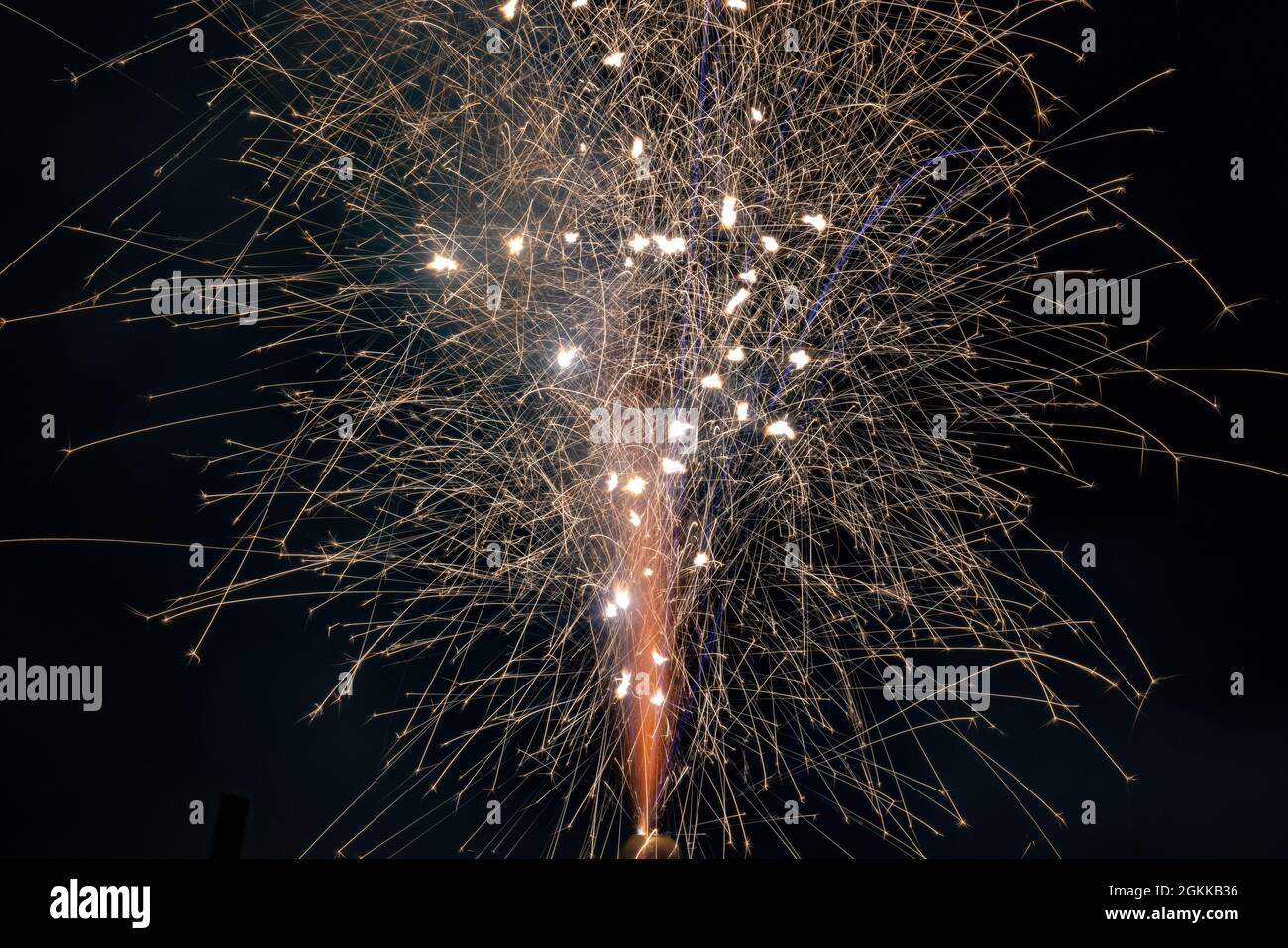 horizontal of ground firework shooting bright sparks in summer Stock ...