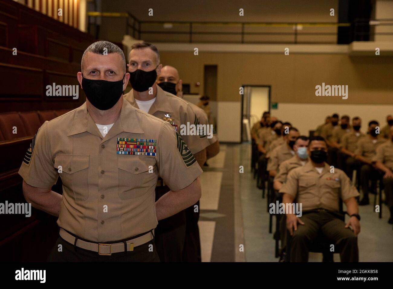 Sgt. Maj. John Tacopino and other guests of honor wait to take the ...