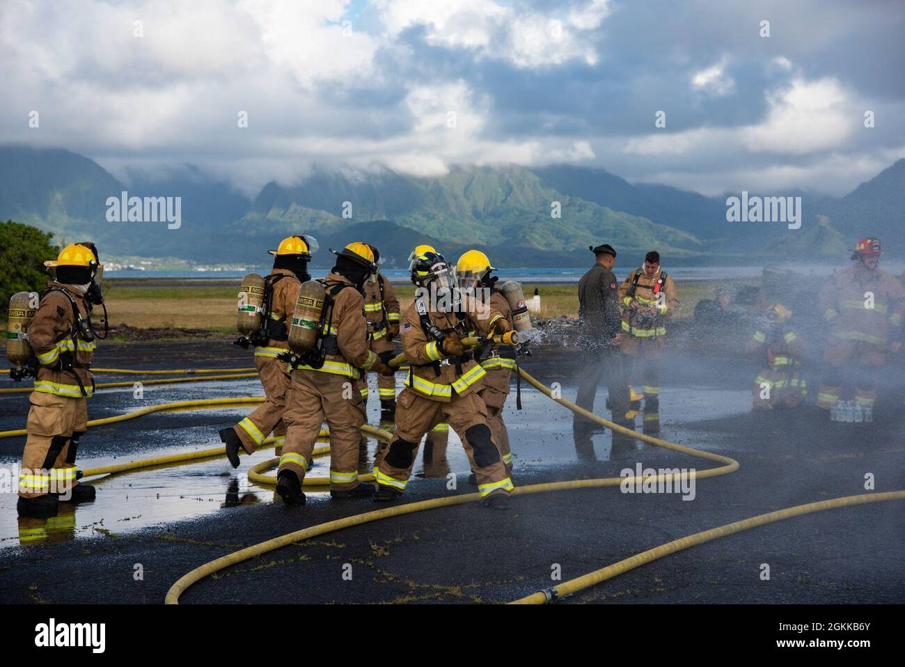 Fire fighters from the 142nd Wing conduct a live fire exercise with ...