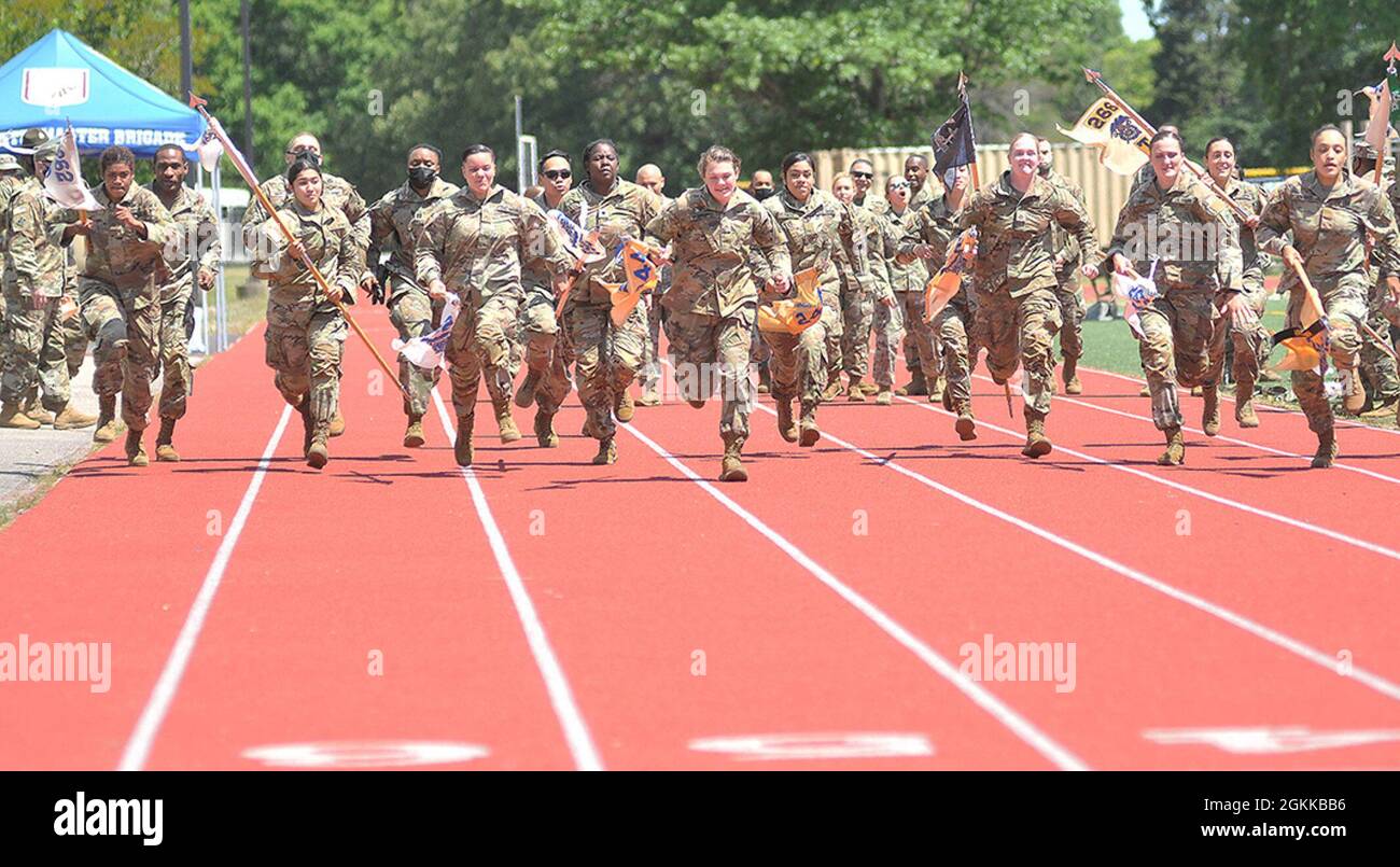 Dragon Brigade guidon-bearing Soldiers sprint toward the finish line ...