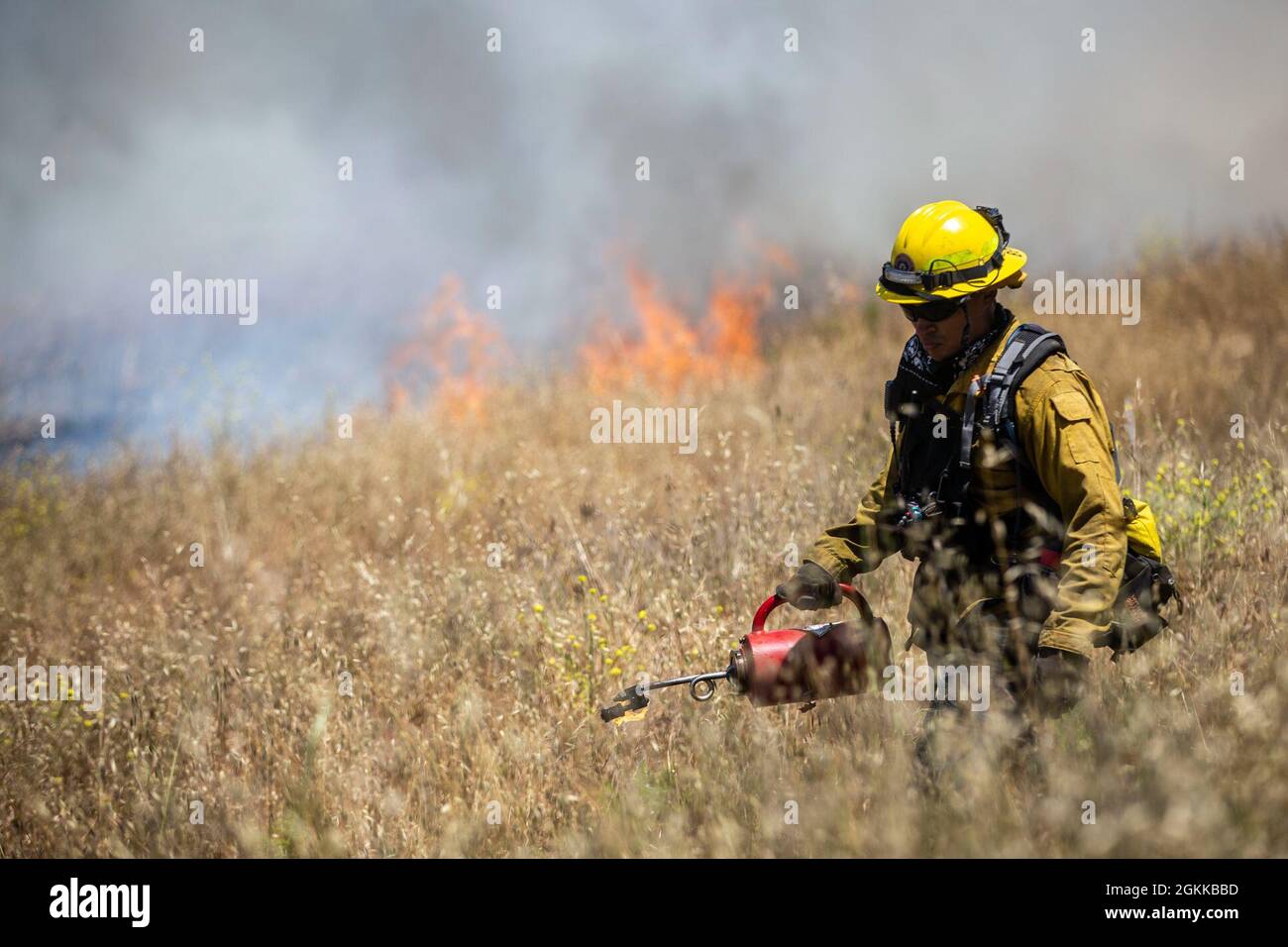 A firefighter with the Camp Pendleton Fire Department ignites dry ...