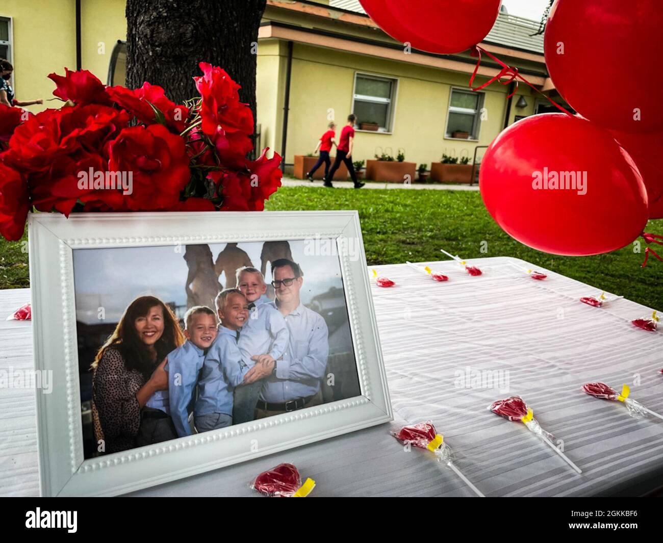 Ehler-Soldatenko family portrait, red flowers and red lollipops for ...