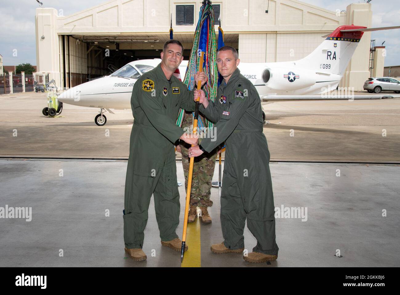 Col. Robert Moschella, 12th Operations Group commander, passes the 99th Flying Training Squadron ...