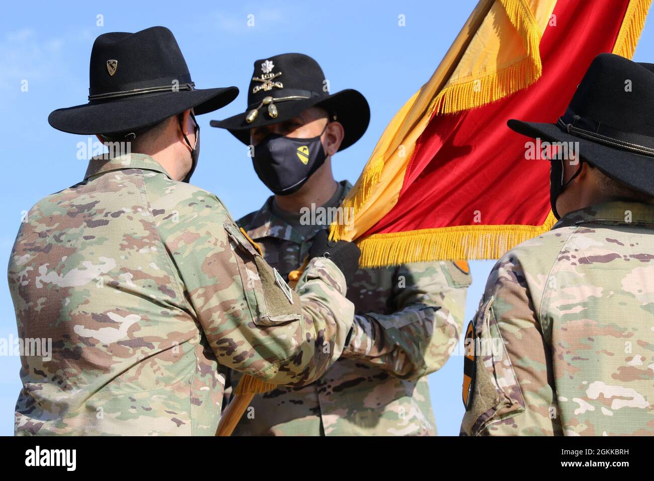 Col. Patrick Disney, Sustainment Brigade commander, hands off the flag ...