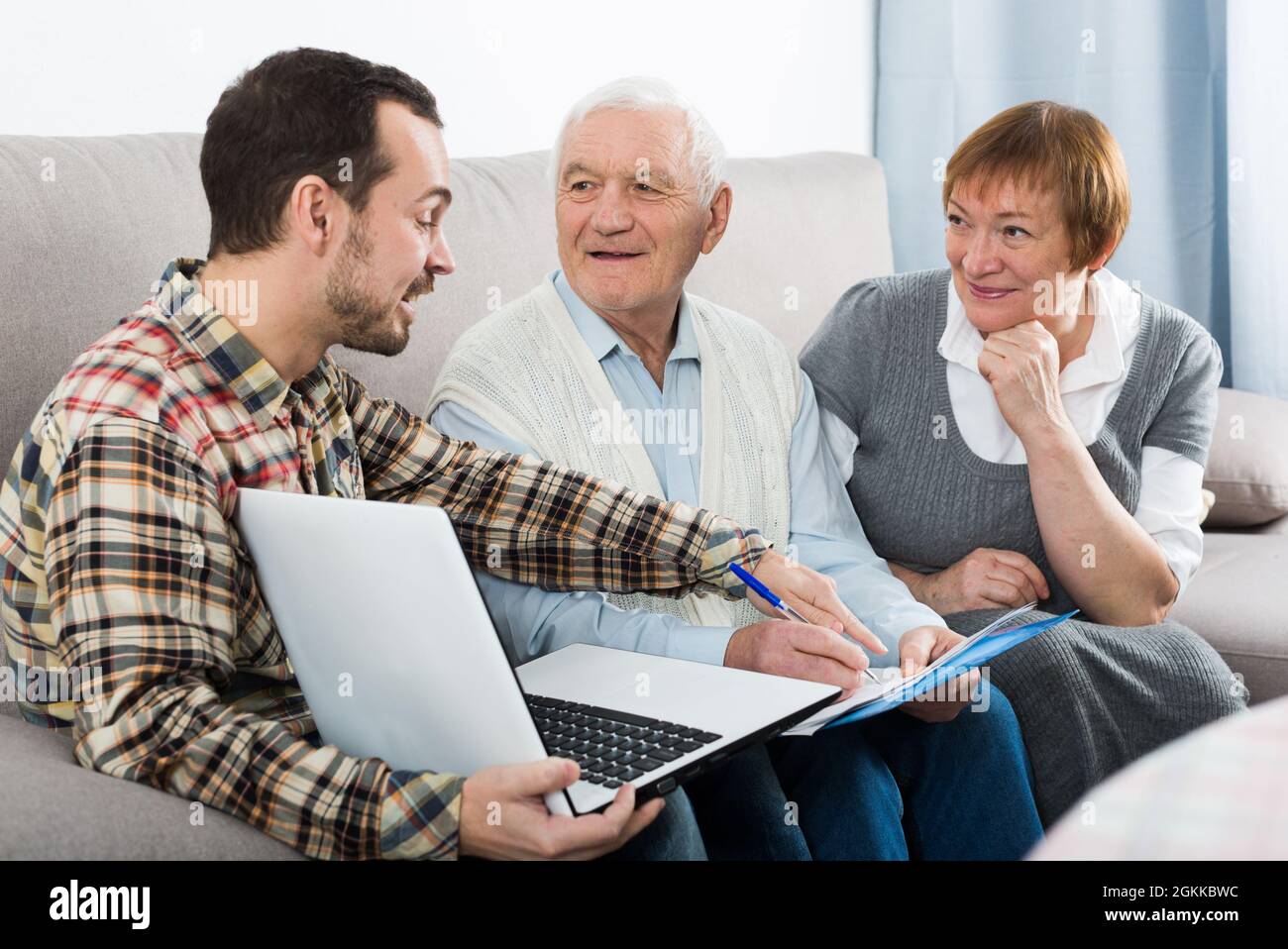 Insurance agent with aged couple hi-res stock photography and images ...