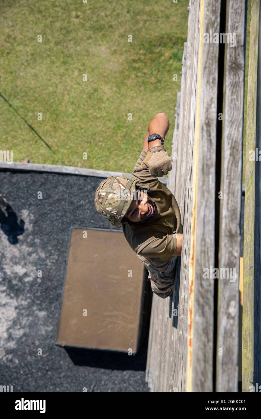 Royal Bermuda Soldier Pvt. Brian Philip climbs over an obstacle in the ...