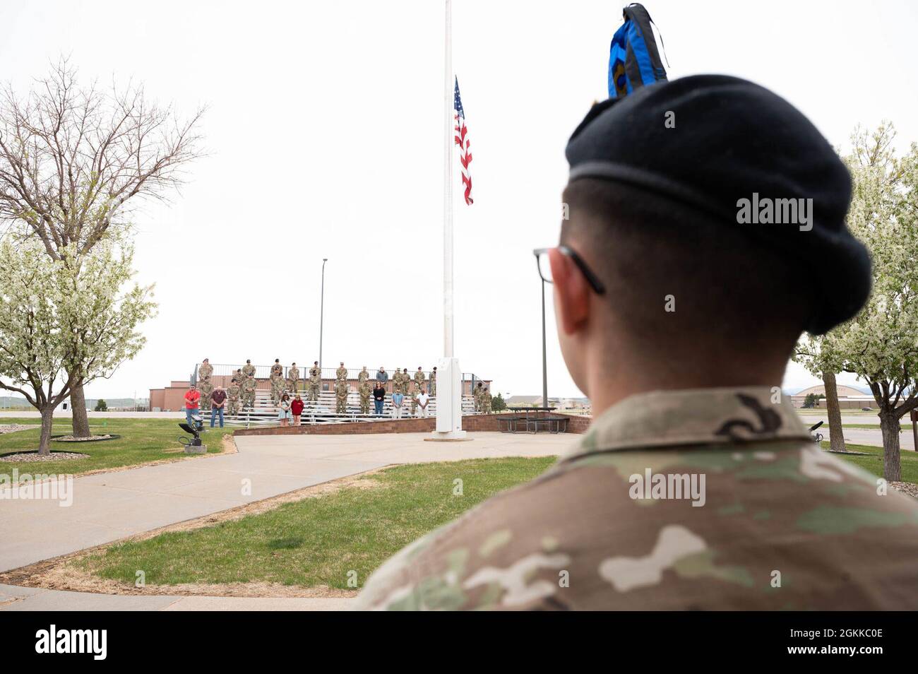 A Defender from the 28th Security Forces Squadron pays respect to the ...