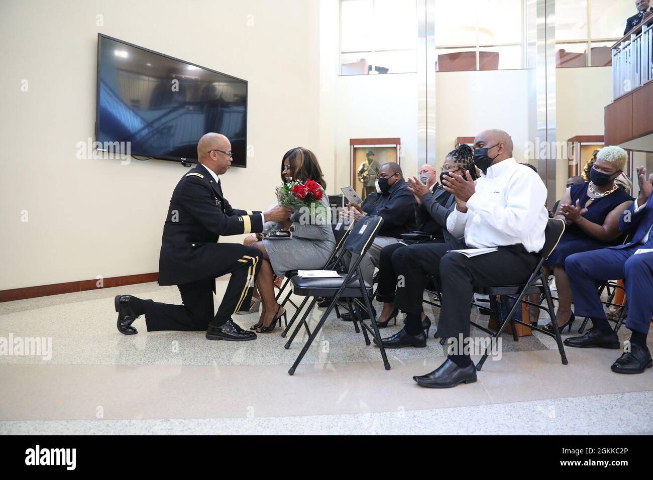 U.S. Army Reserve Lt. Gen. A.C. Roper presents flowers to his wife, Mrs ...