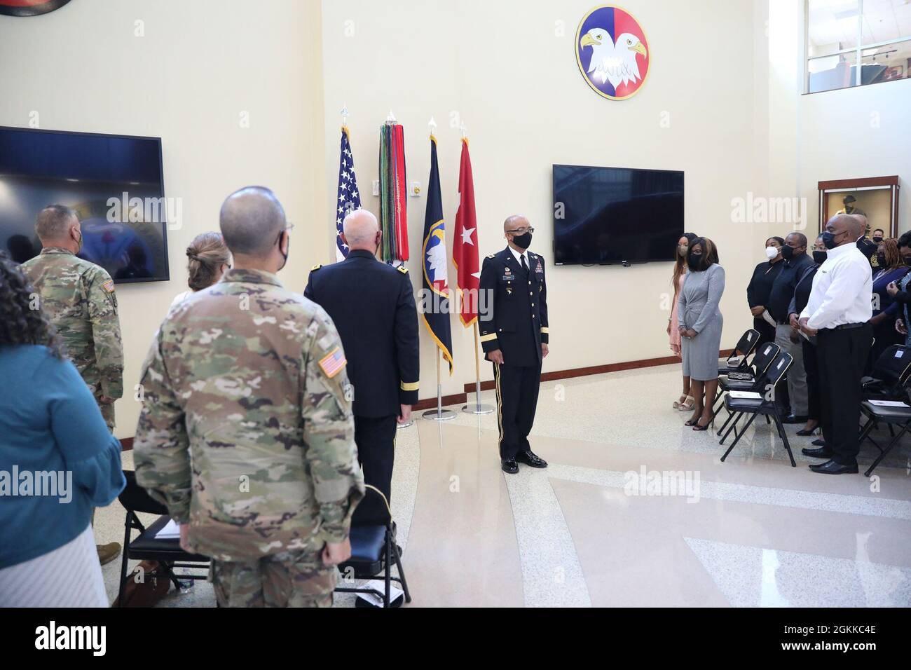 U.S. Army Reserve Lt. Gen. A.C. Roper (center) stands at attention with ...