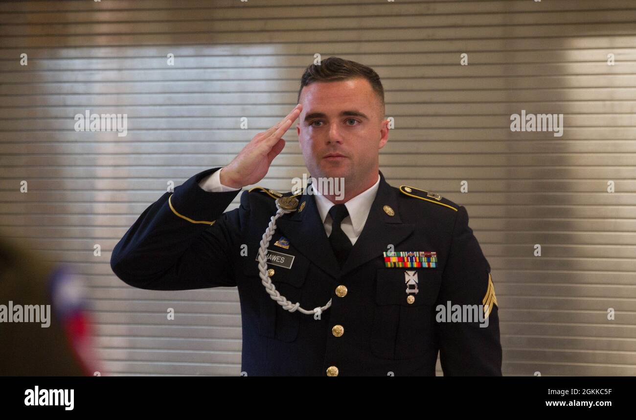 Sgt. Wyatt Hawes, 501st Military Intelligence Brigade, renders a salute ...