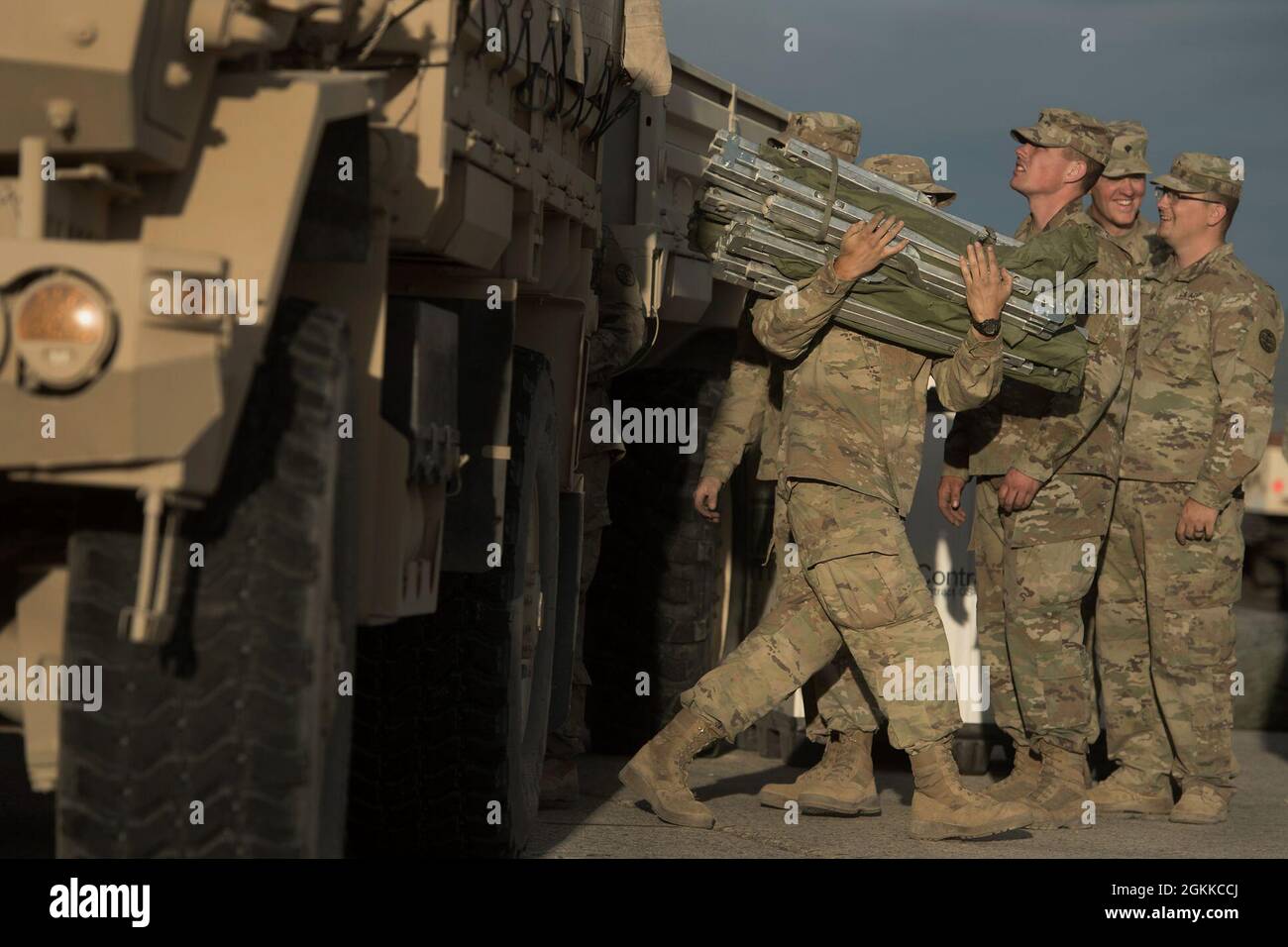 Stacks of racks are unloaded from company trucks in the company ...