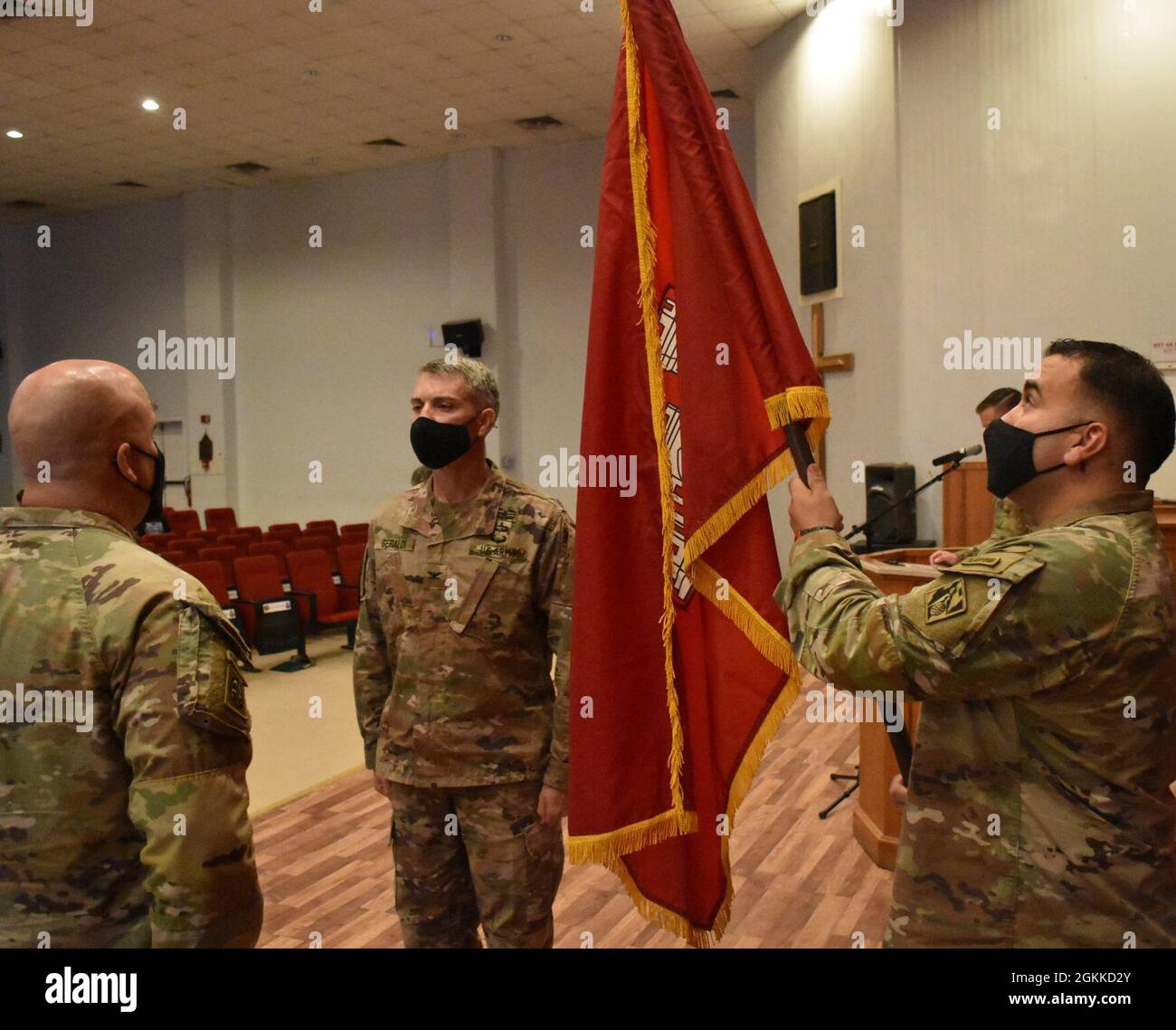 Sergeant First Class Joseph Harrison prepares to pass on the colors of ...