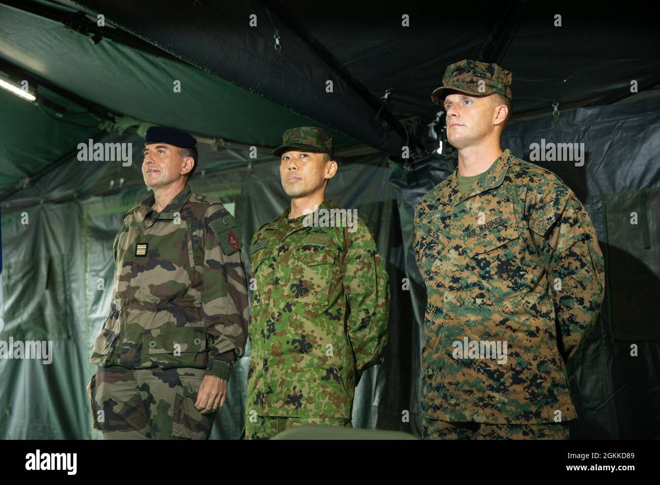 Lt. Col. Jeremy Nelson, commander of Marine Forces (right), Col ...