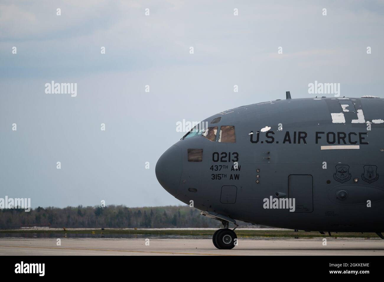 A U.S. Air Force C-17 Globemaster III assigned to the 437th Airlift Wing rests on the flight ...