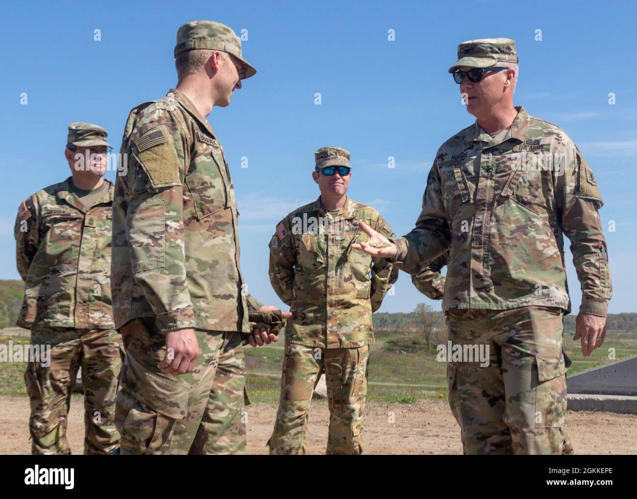Col. Gary Ropers, 92nd Troop Command Commander, presents Spc. Beranek a ...