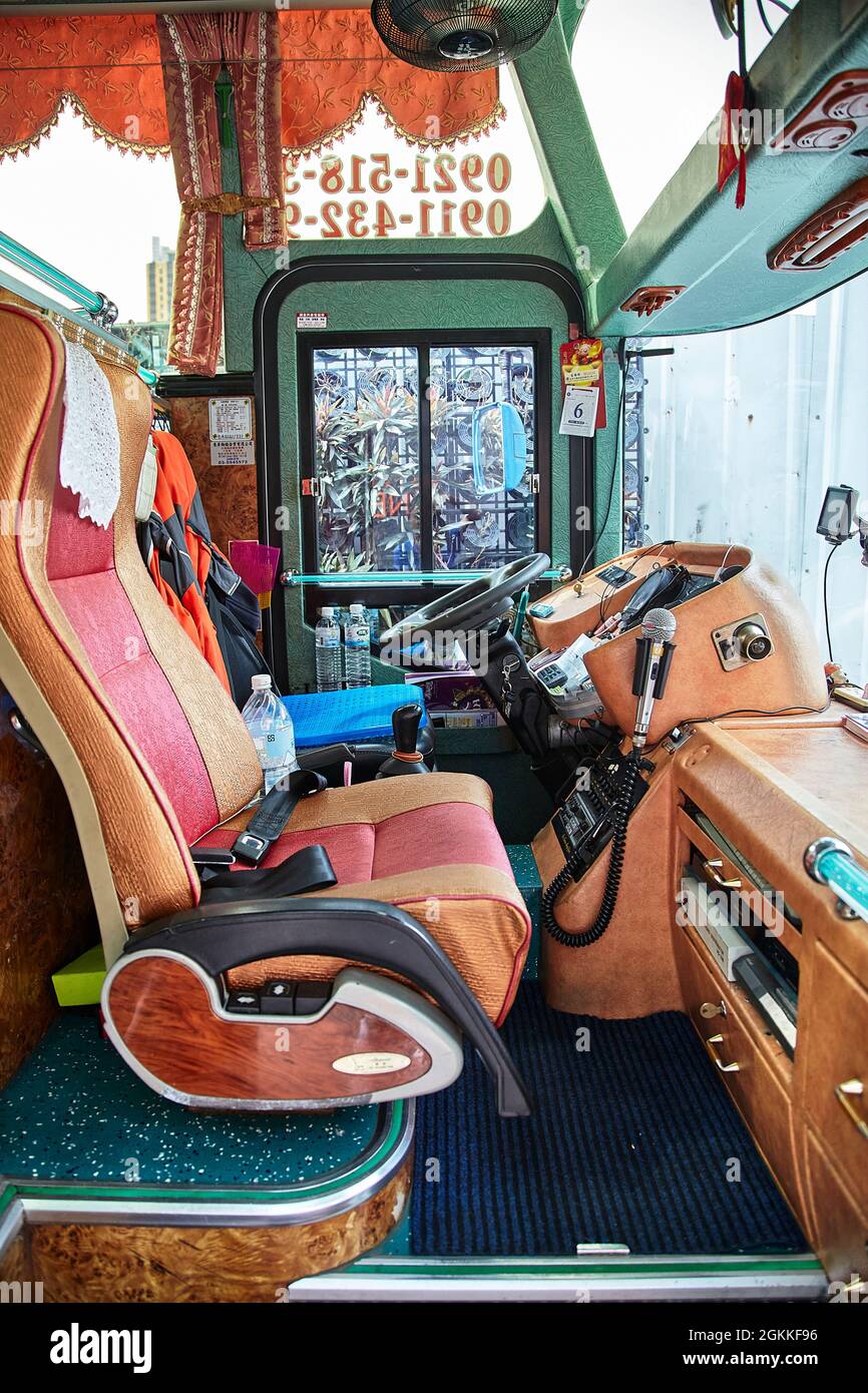 View of the interior of a driver's cabin inside a tourist guide bus ...