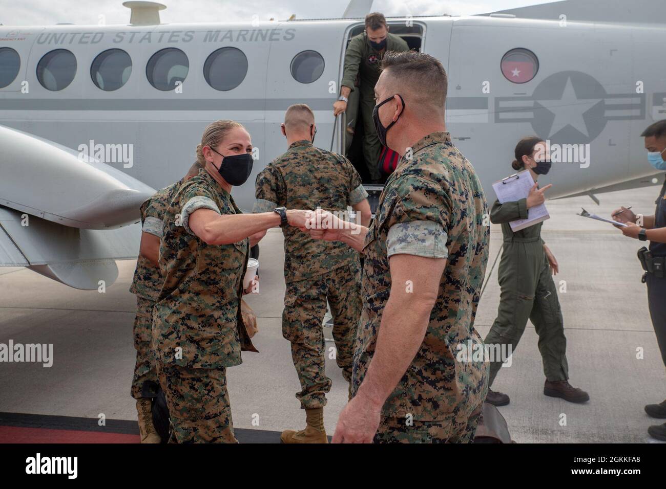 Lt. Col. Tate Buntz, the Marine Corps Base (MCB) Camp Blaz Operations Officer, greets Sgt. Maj ...