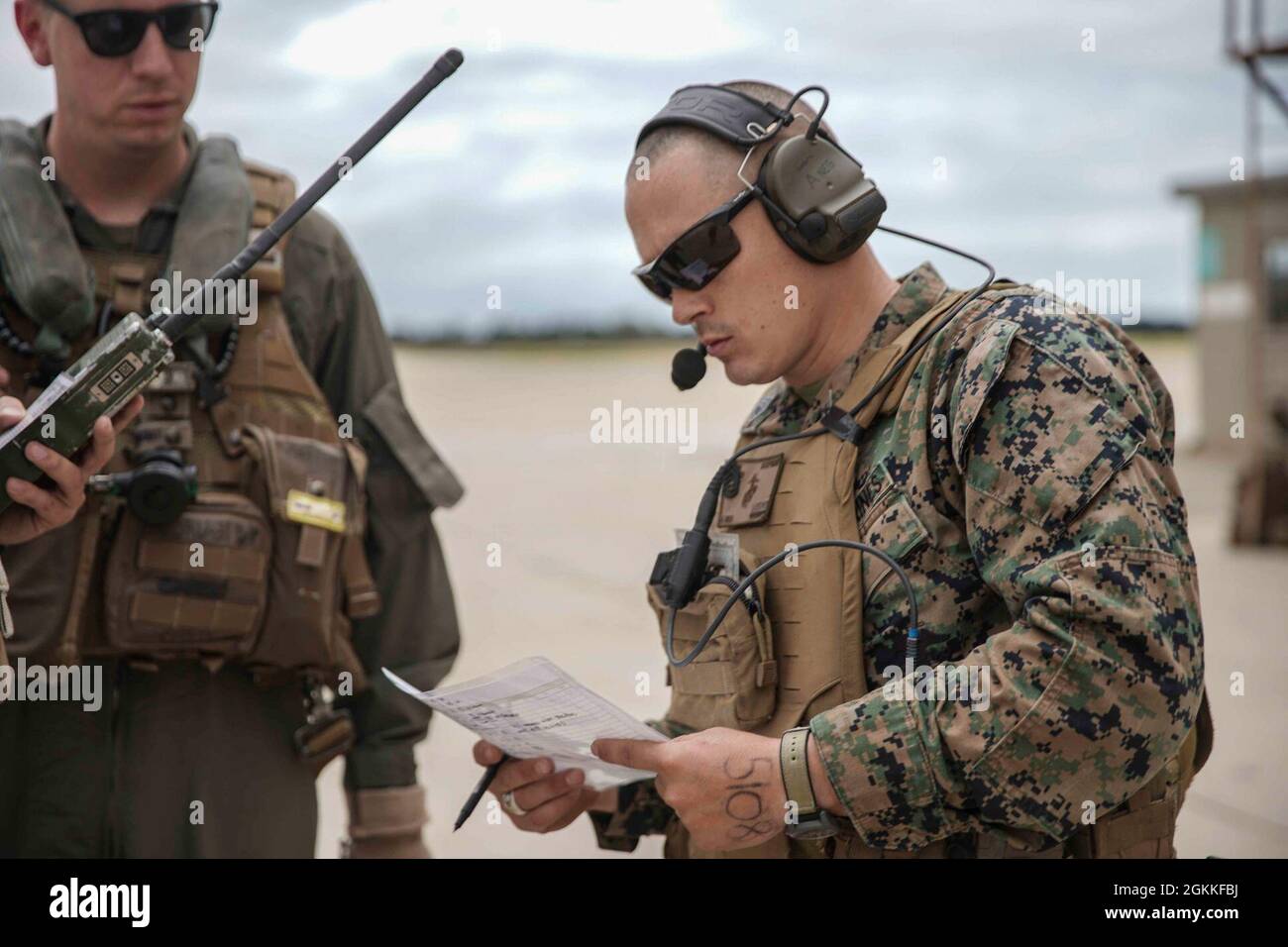 U.S. Marine Corps Gunnery Sgt. David Stephens, right, company Gunnery ...