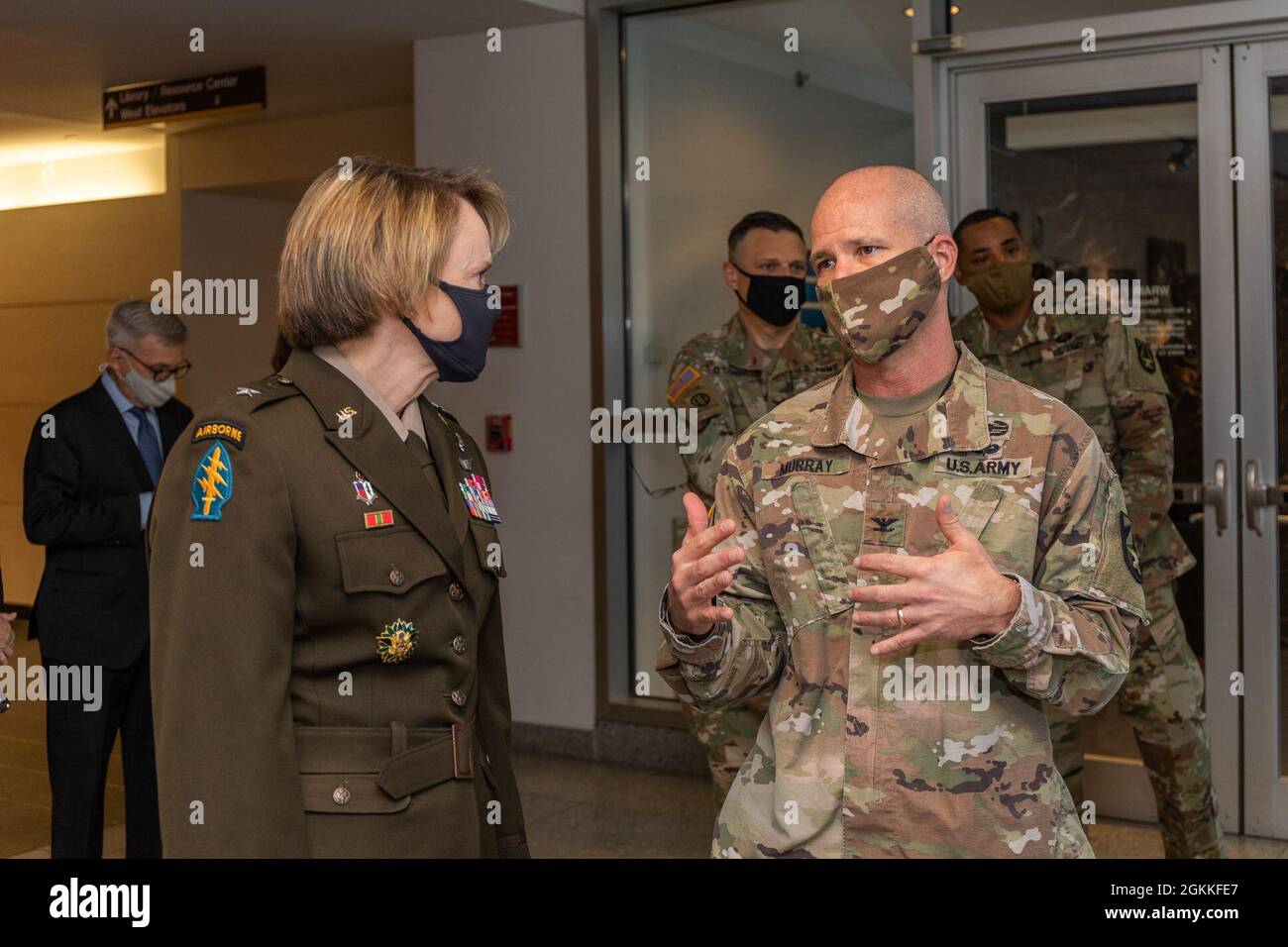 Col. Clinton Murray (right), WRAIR commander, provides an introductory ...