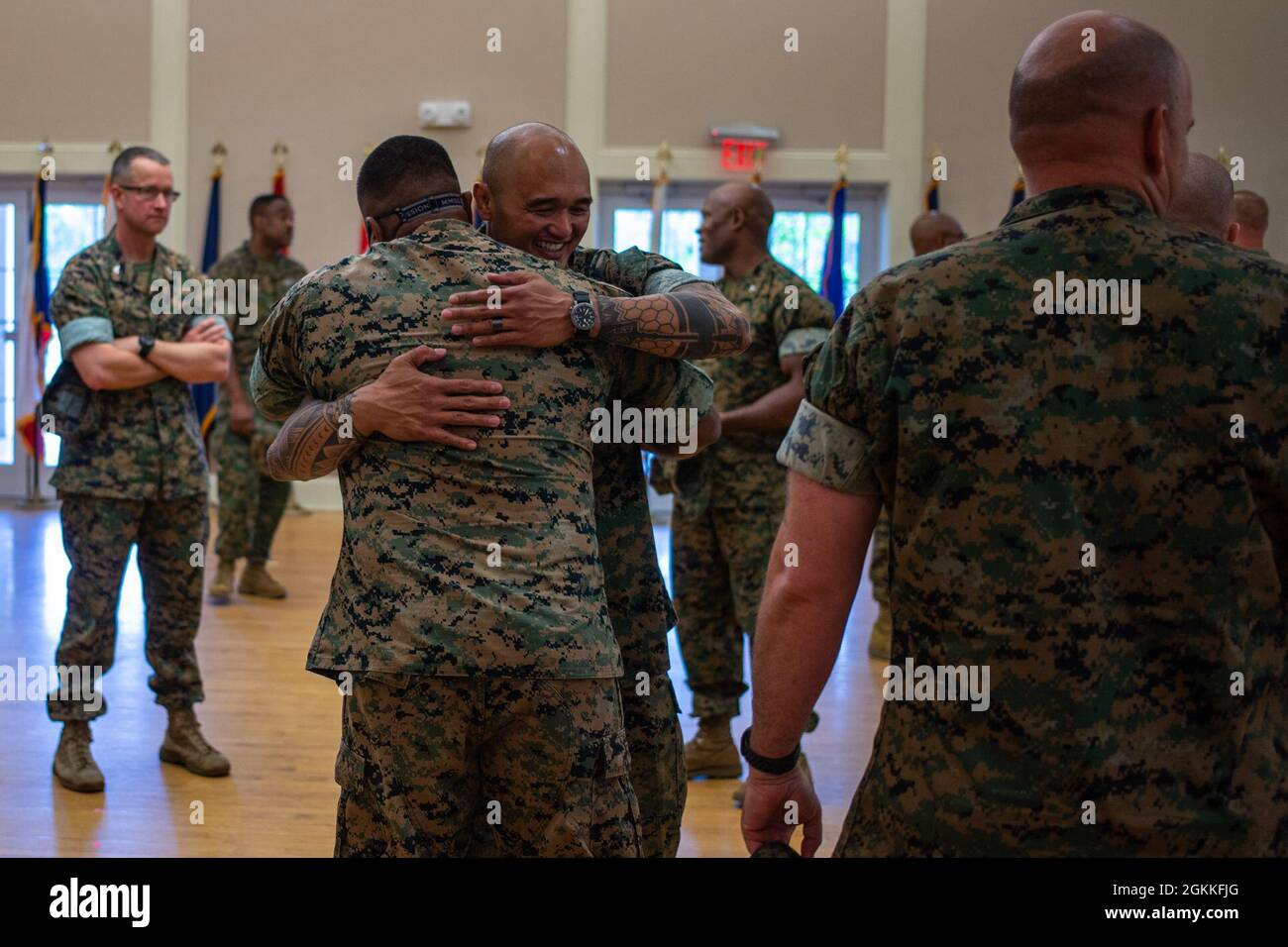 Marines, Sailors and civilians celebrate after a change of charge ...