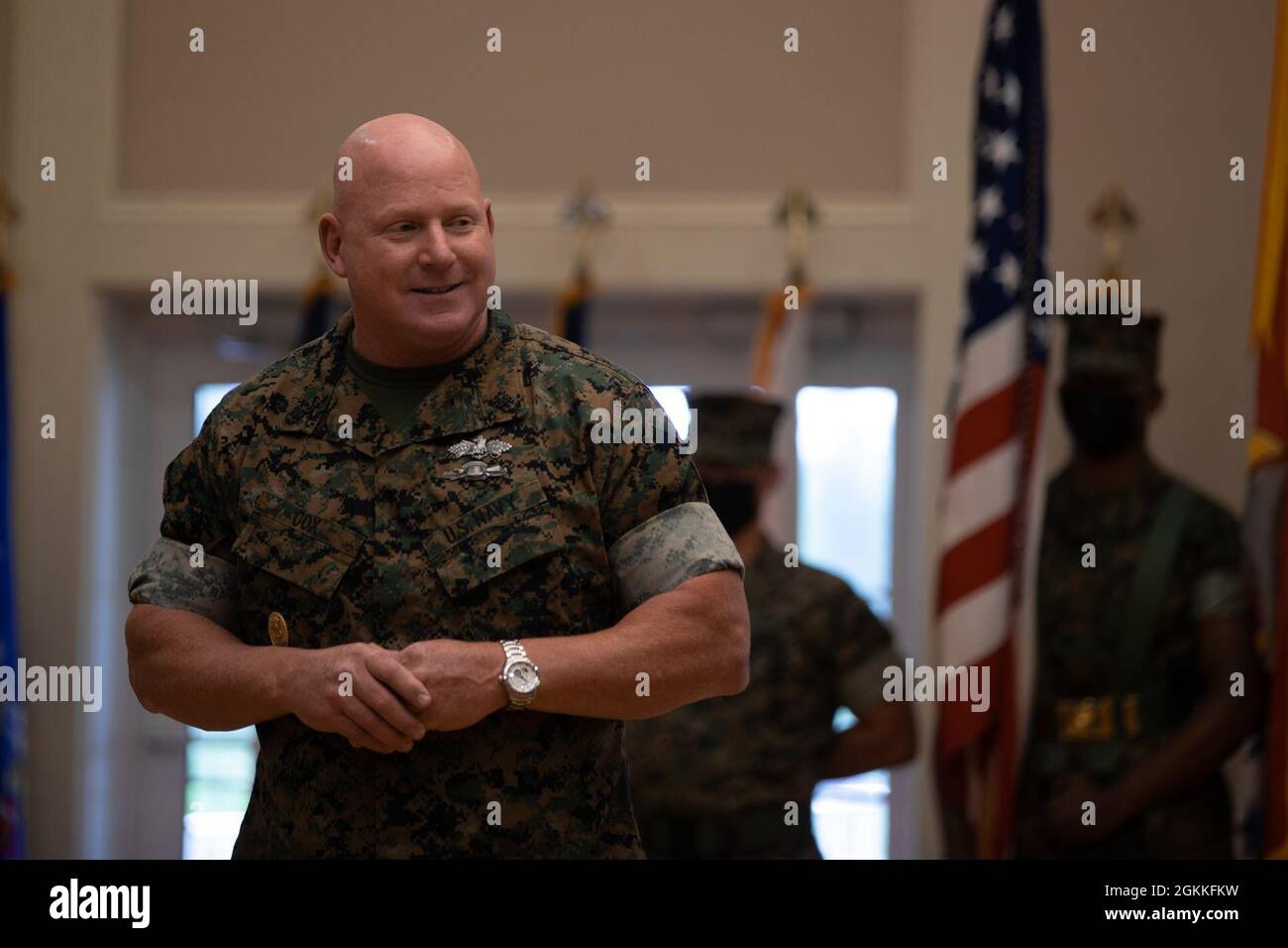 U.S. Navy Master Chief Petty Officer Scottie Cox gives remarks during a ...