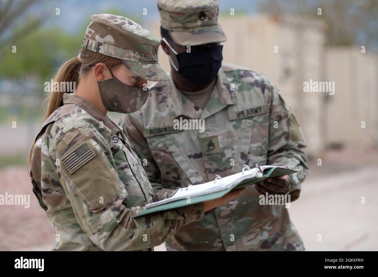 Spc. Maura Spence, left, an intelligence analyst from Katy, Texas, and ...