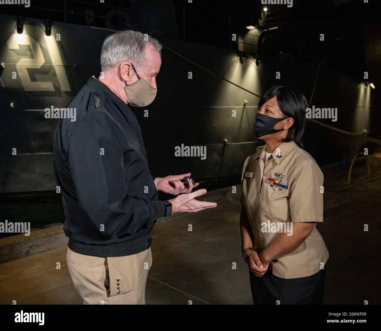 Vice Chief of Naval Operations Adm. Bill Lescher speaks with Machinist ...