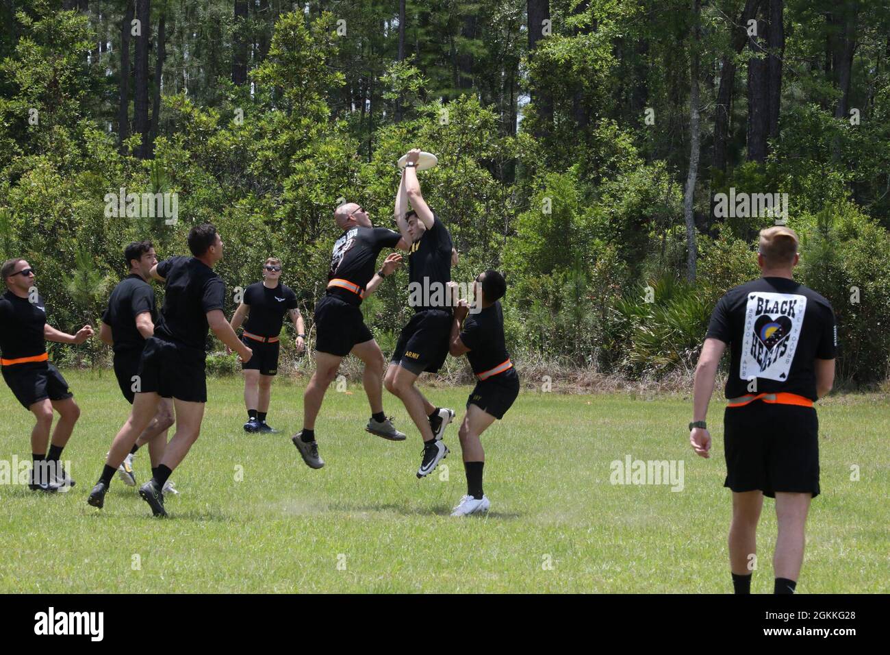 Soldiers with 3rd Infantry Division fight to catch a Frisbee in an ...