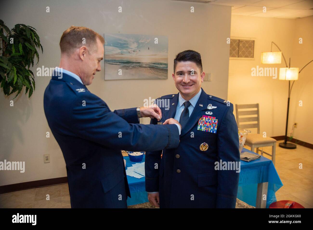 Col. Benjamin R. Jonsson, the 6th Air Refueling Wing commander, pins a ...