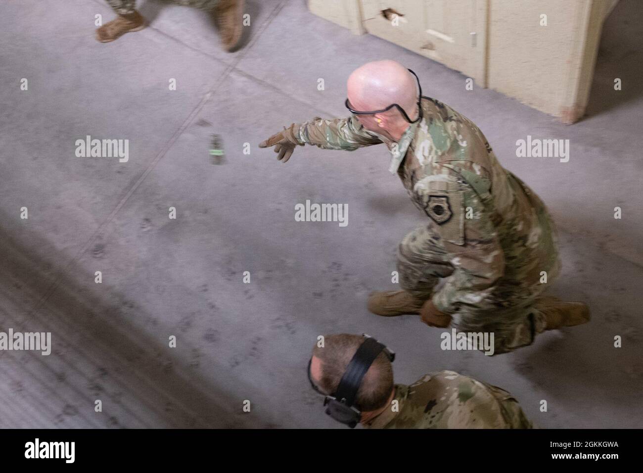 Maj. Gen. Michael Lutton, 20th Air Force commander, throws a flashbang ...
