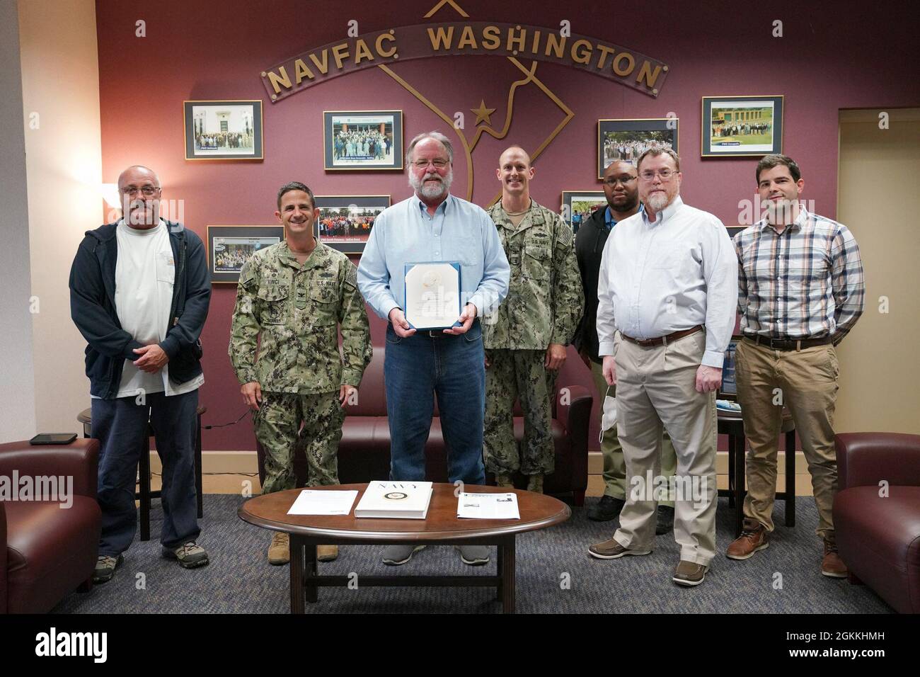 Bryan R. Dewey is presented a letter of appreciation from Capt. Greg ...