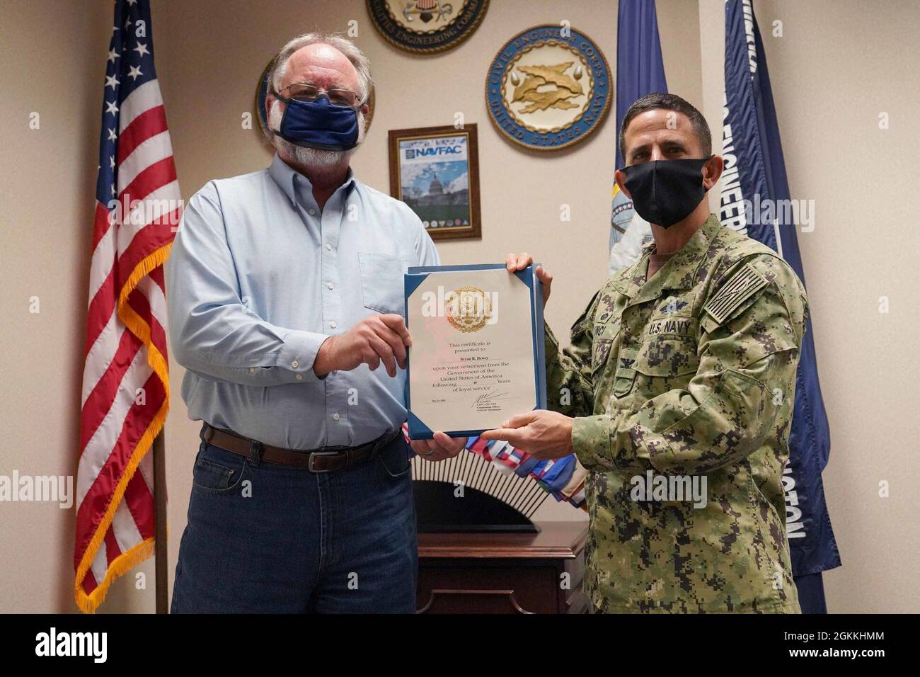 Bryan R. Dewey is presented a letter of appreciation from Capt. Greg ...