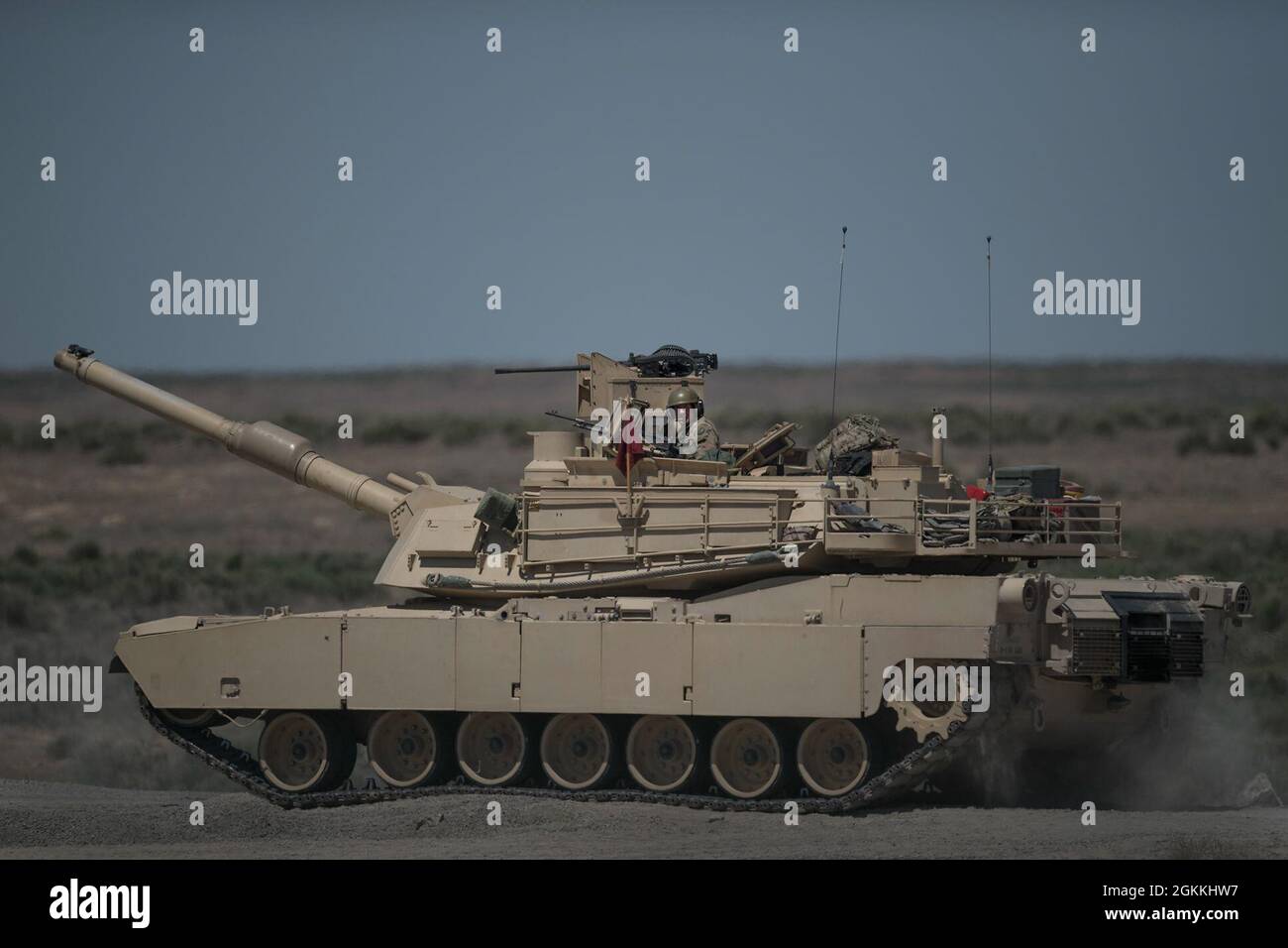 After firing at the first battle position, an Abrams tank begins moving ...