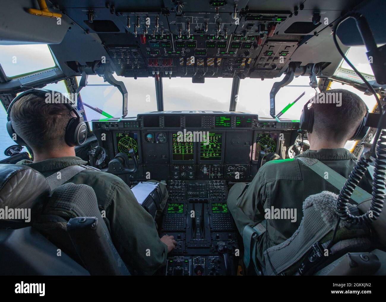 U.S. Marine Corps Capt. Zachary Gibson and Capt. Jared Cass examine the ...