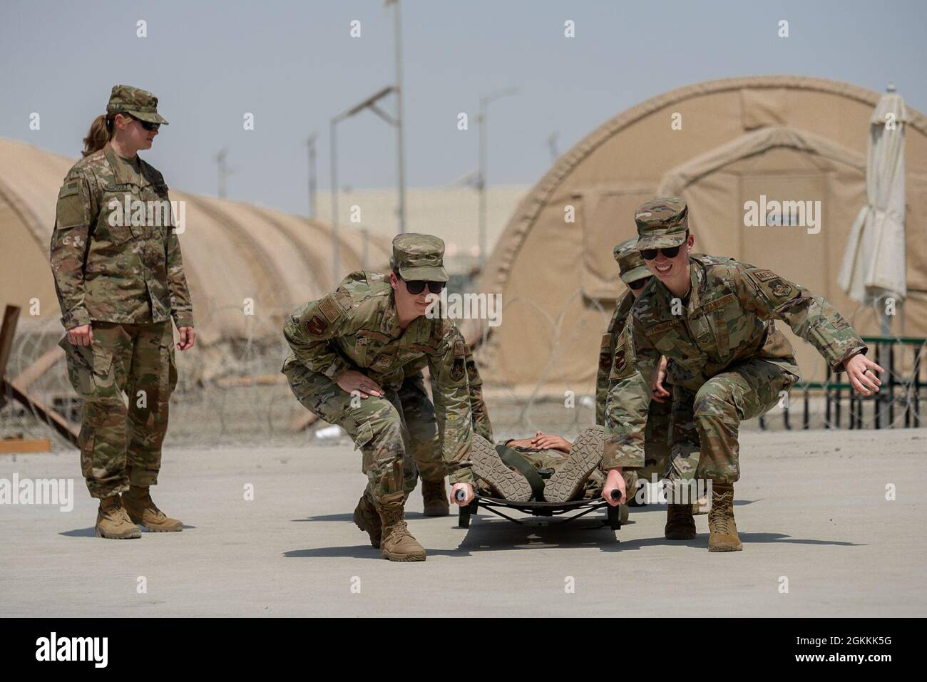 U.S. Air Force and Army medics perform a four-man litter carry as part ...