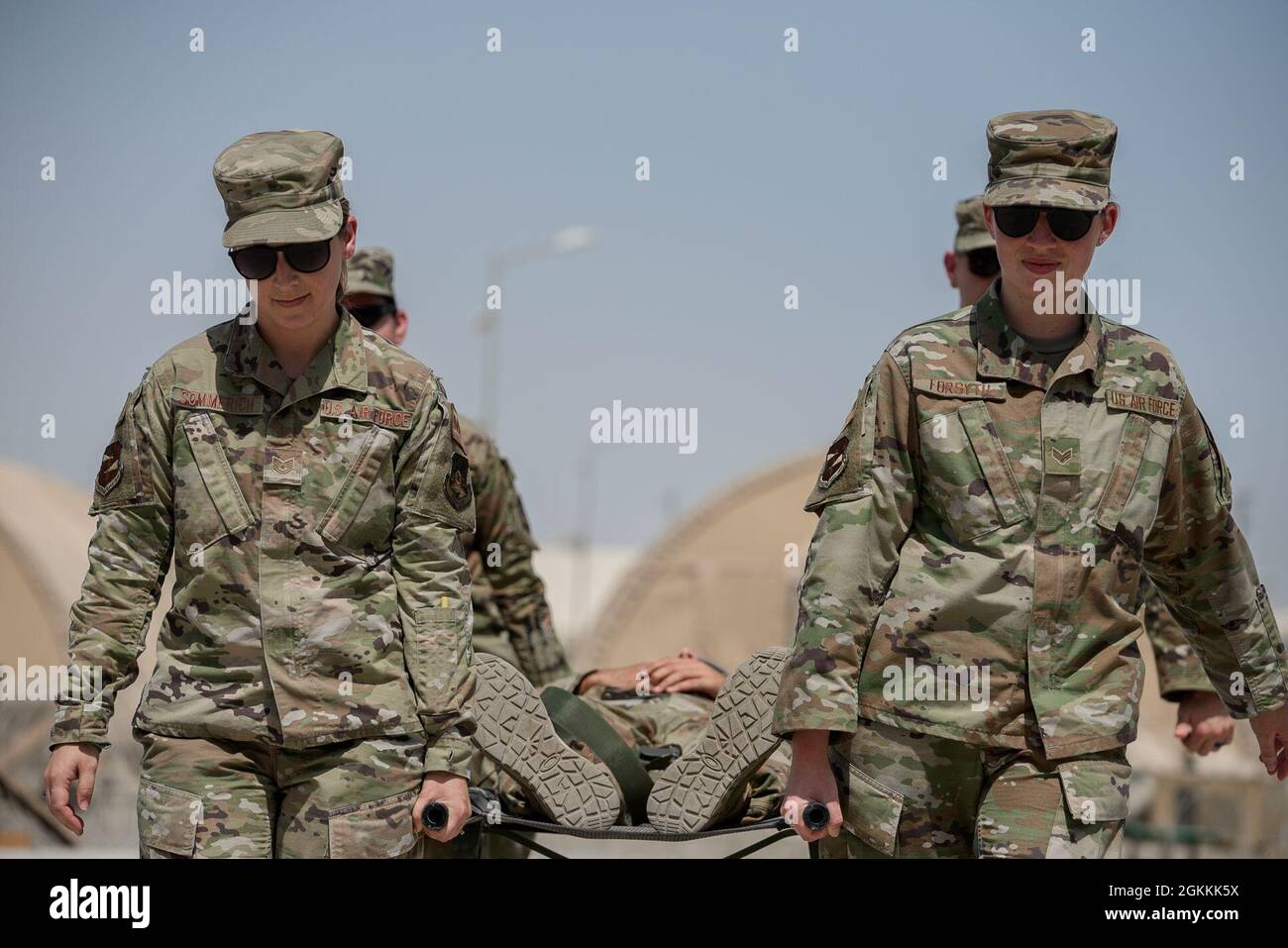 U.S. Air Force and Army medics perform a four-man litter carry as part ...