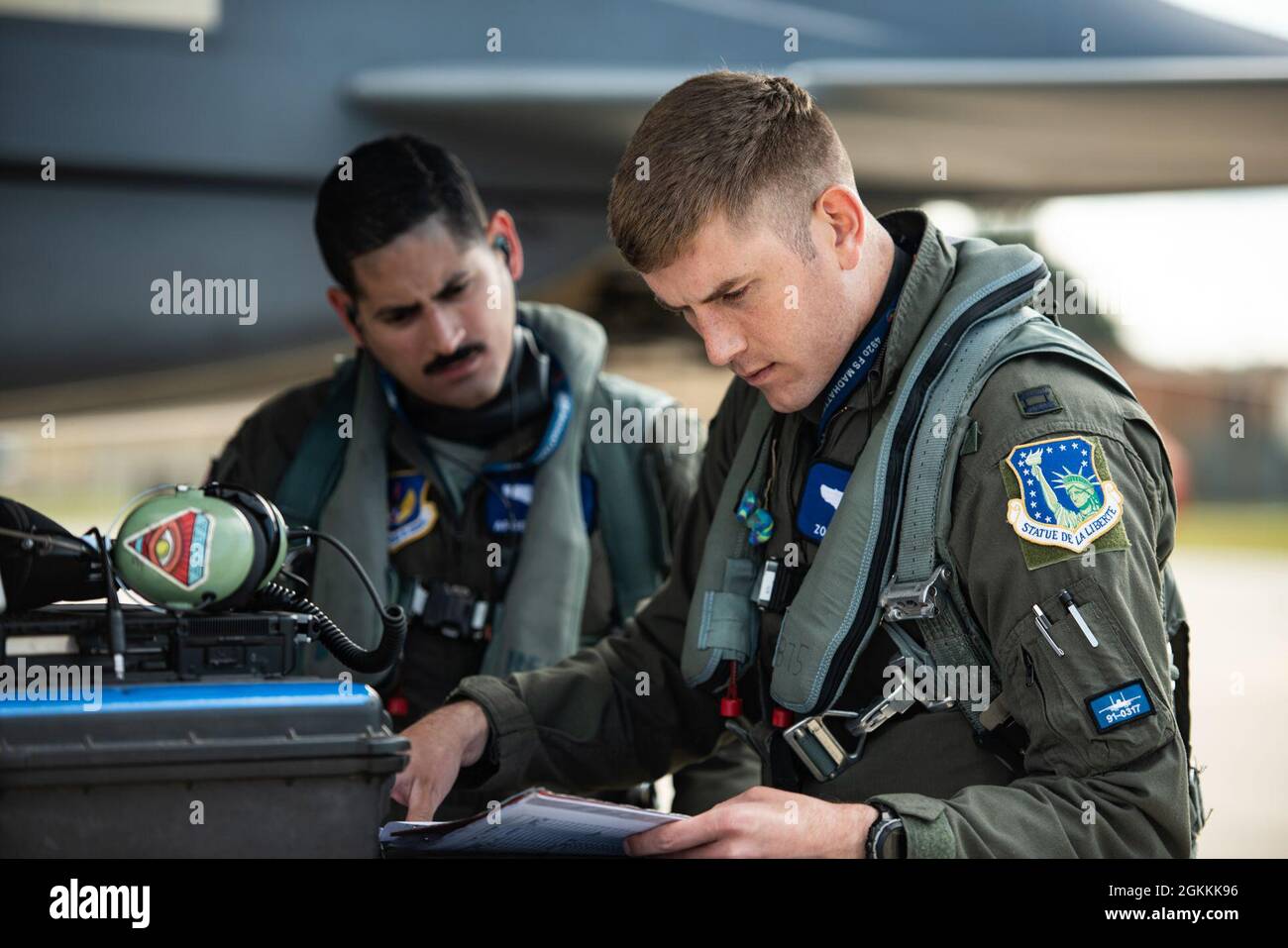 U.S. Air Force pilots assigned to the 492nd Fighter Squadron read ...