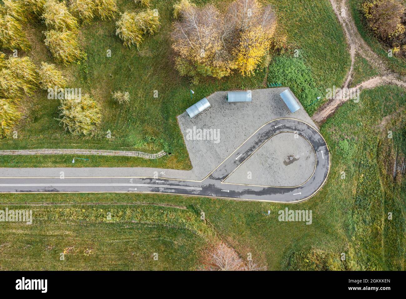 end of bike lane and footpath in suburb area. autumn landscape. top ...