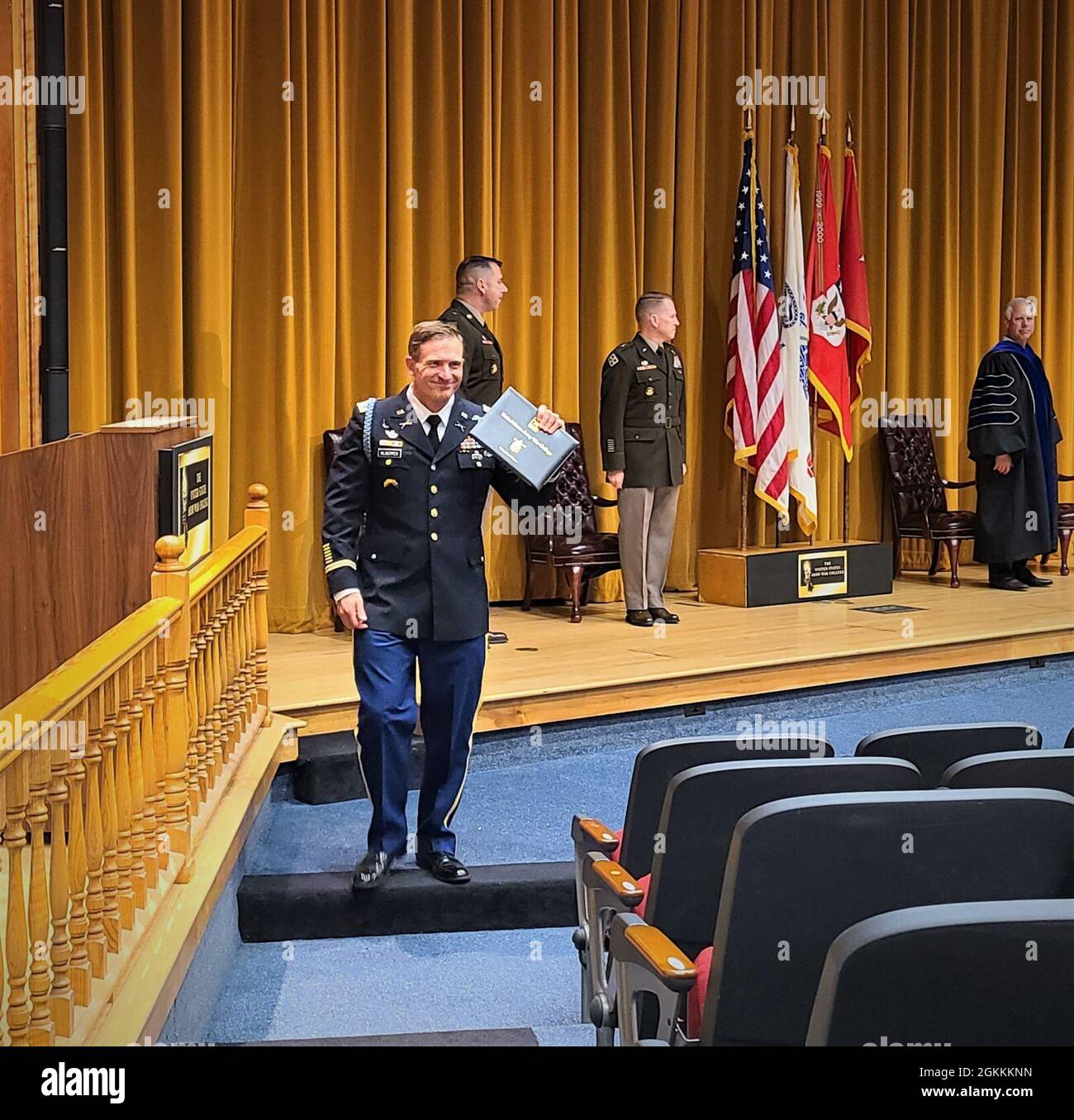 Col. Michael Kloepper, shows off his Army War College diploma Stock ...