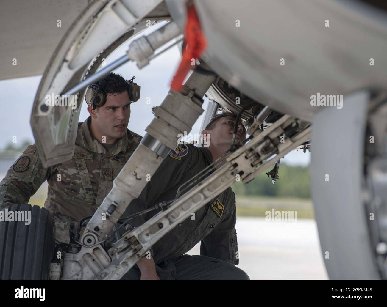 U.S. Air Force Capt. Chad Dove, 79th Fighter Squadron (FS) pilot, right ...