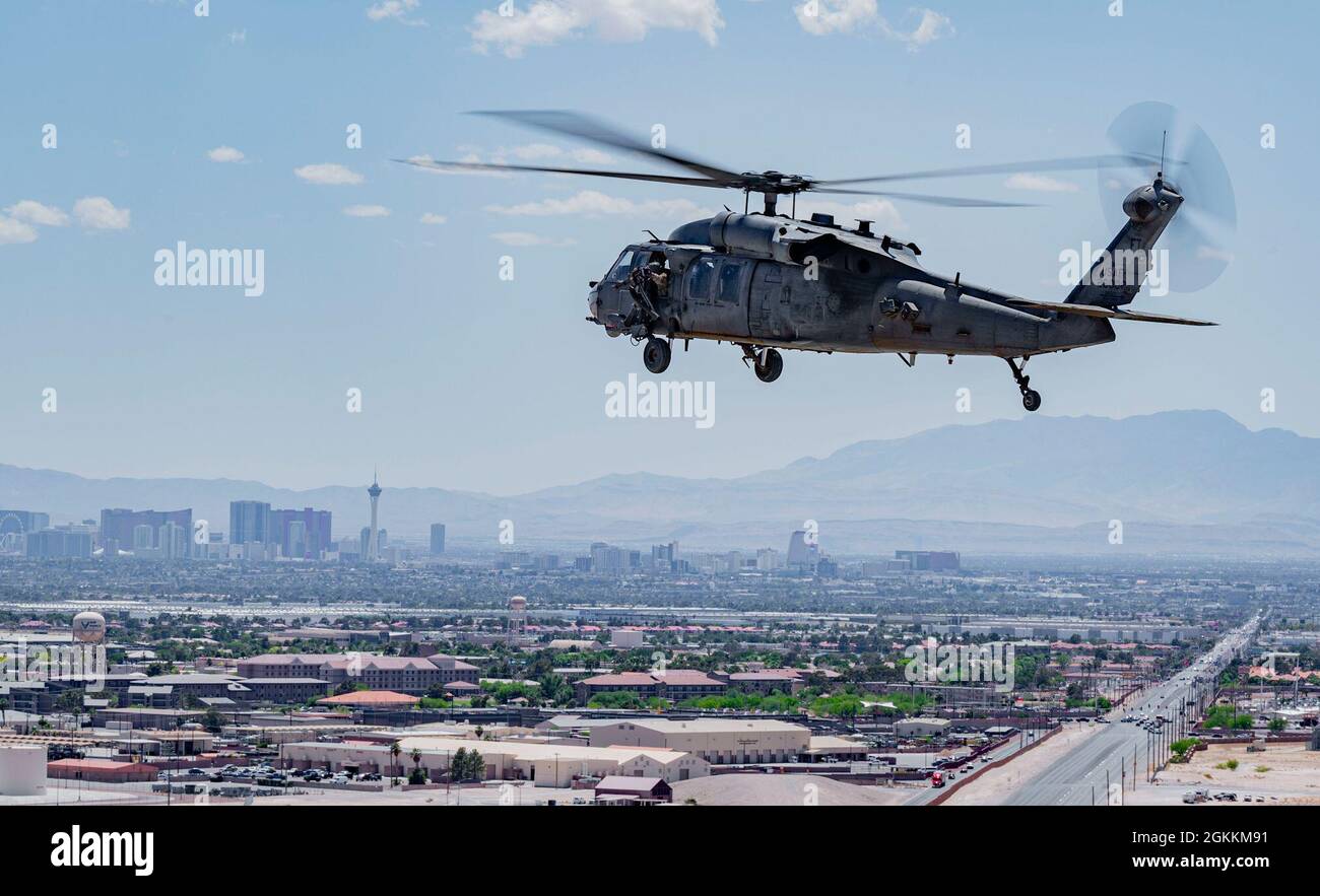 An HH-60G Pave Hawk assigned to the 34th Weapons Squadron flies over ...