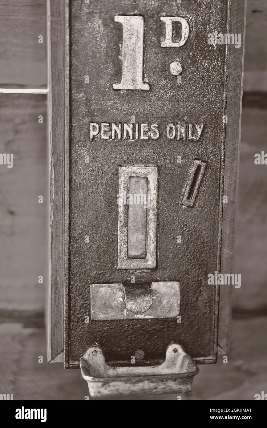 Vintage penny slot machine on display, monotone image in shallow depth ...