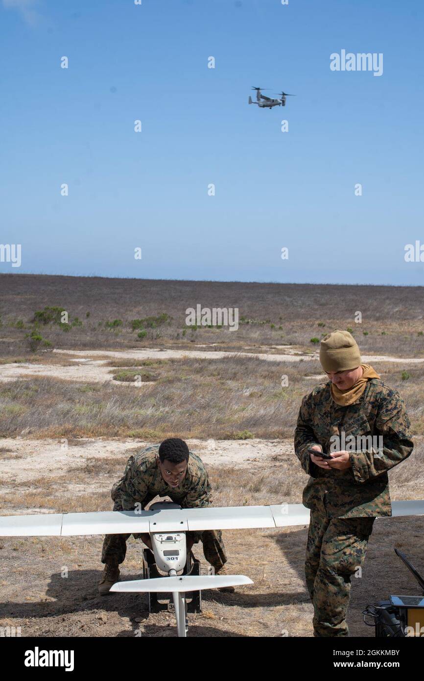 U.S. Marine Corps Cpl. Terrell Douglas, left, a radio operator, and ...