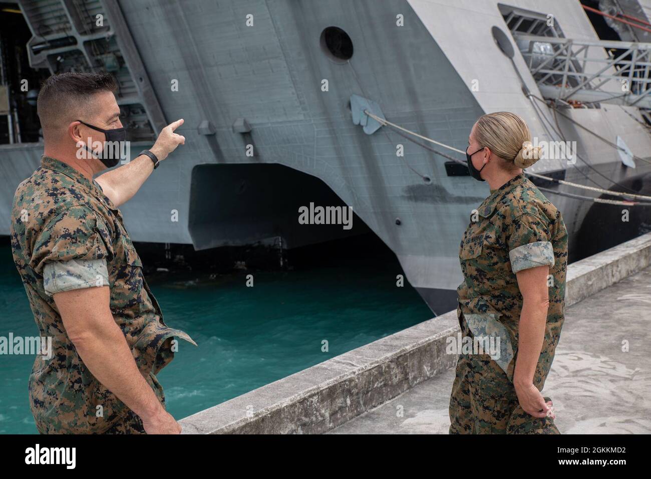 Lt. Col. Tate Buntz, the Marine Corps Base (MCB) Camp Blaz Operations Officer, left, briefs Sgt ...