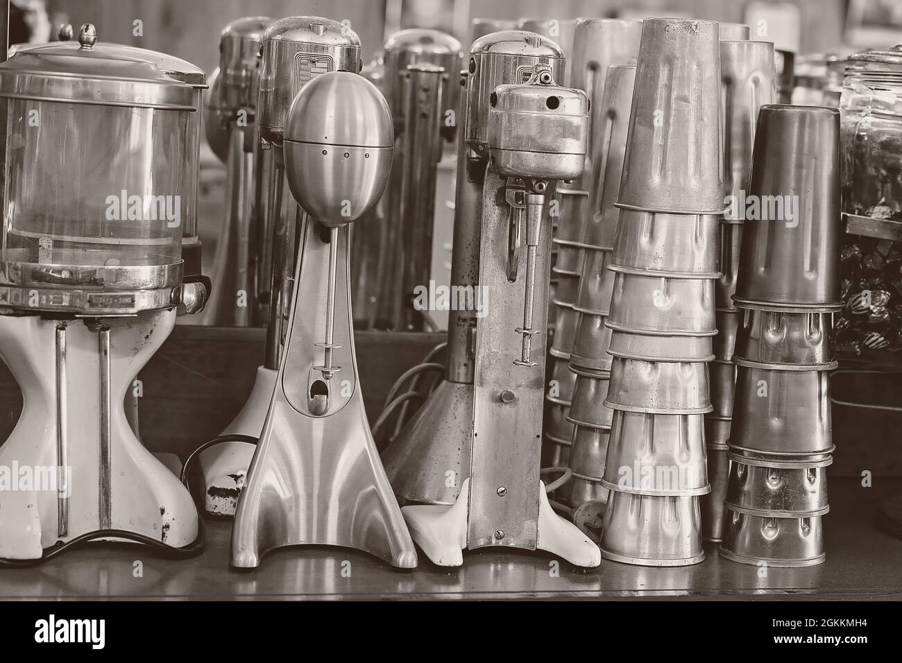 A collection of vintage milkshake makers on display - monotone image in ...