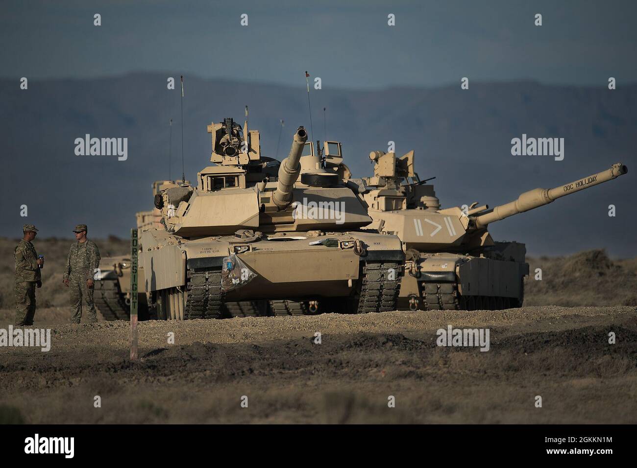 Tank crews work on their equipment before moving out to the gunnery ...