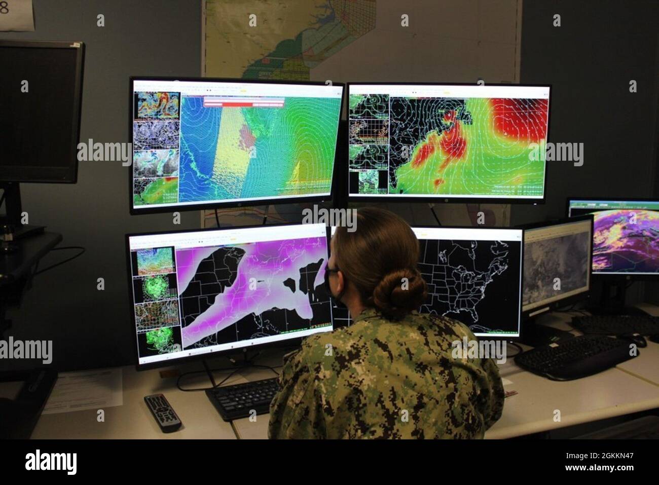 A U.S. Navy Aerographer’s Mate uses the AWIPS display on FWC-Norfolk’s ...