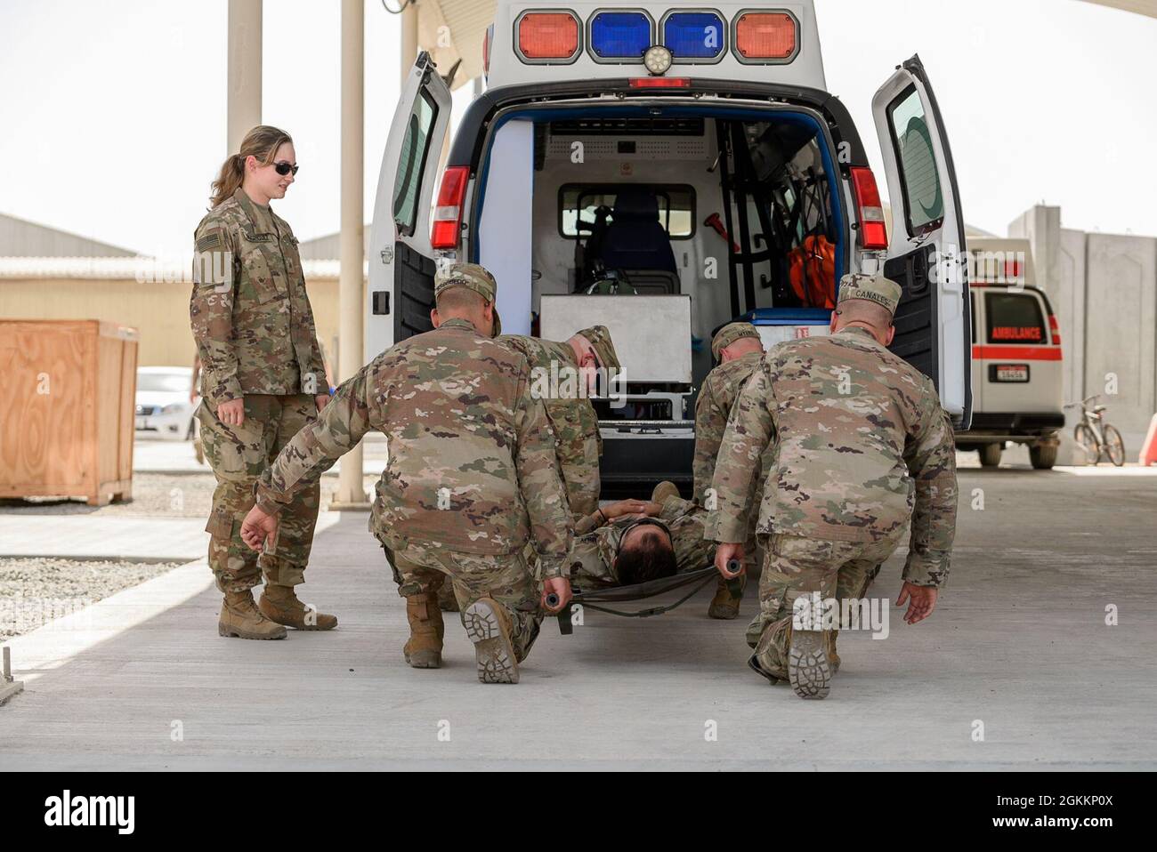 U.S. Air Force and Army medics perform a four-man litter carry as part ...